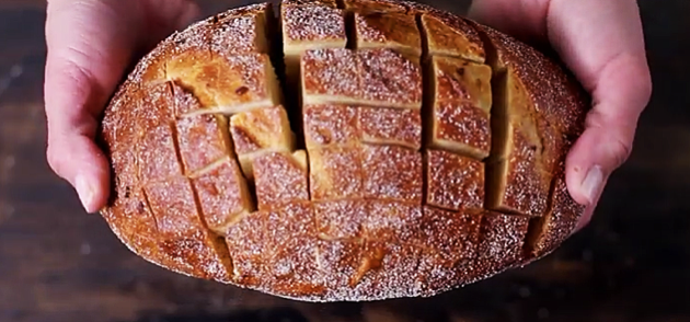 Woman Cuts This Bread Into A Bunch Of Little Squares. When She's Done YUM!