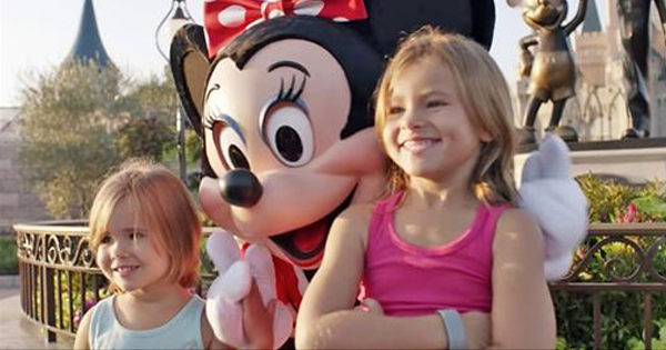 These 2 Sisters Pose For A Photo With Minnie Mouse.
