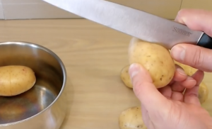 This Guy Makes A Weird Slice Into These Raw Potatoes Before He Boils ...