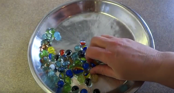 She Places A Bunch Of Marbles In A Bowl Then Bakes Them In The Oven ...
