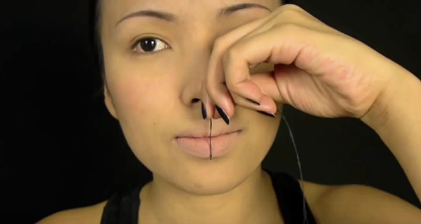 She Presses A Needle and String Onto Her Lips. The End Result Is So Trippy!