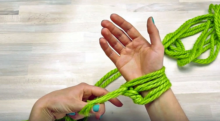 She Takes Yarn And Wraps It Around Her Wrist. When She's Done It's a ...